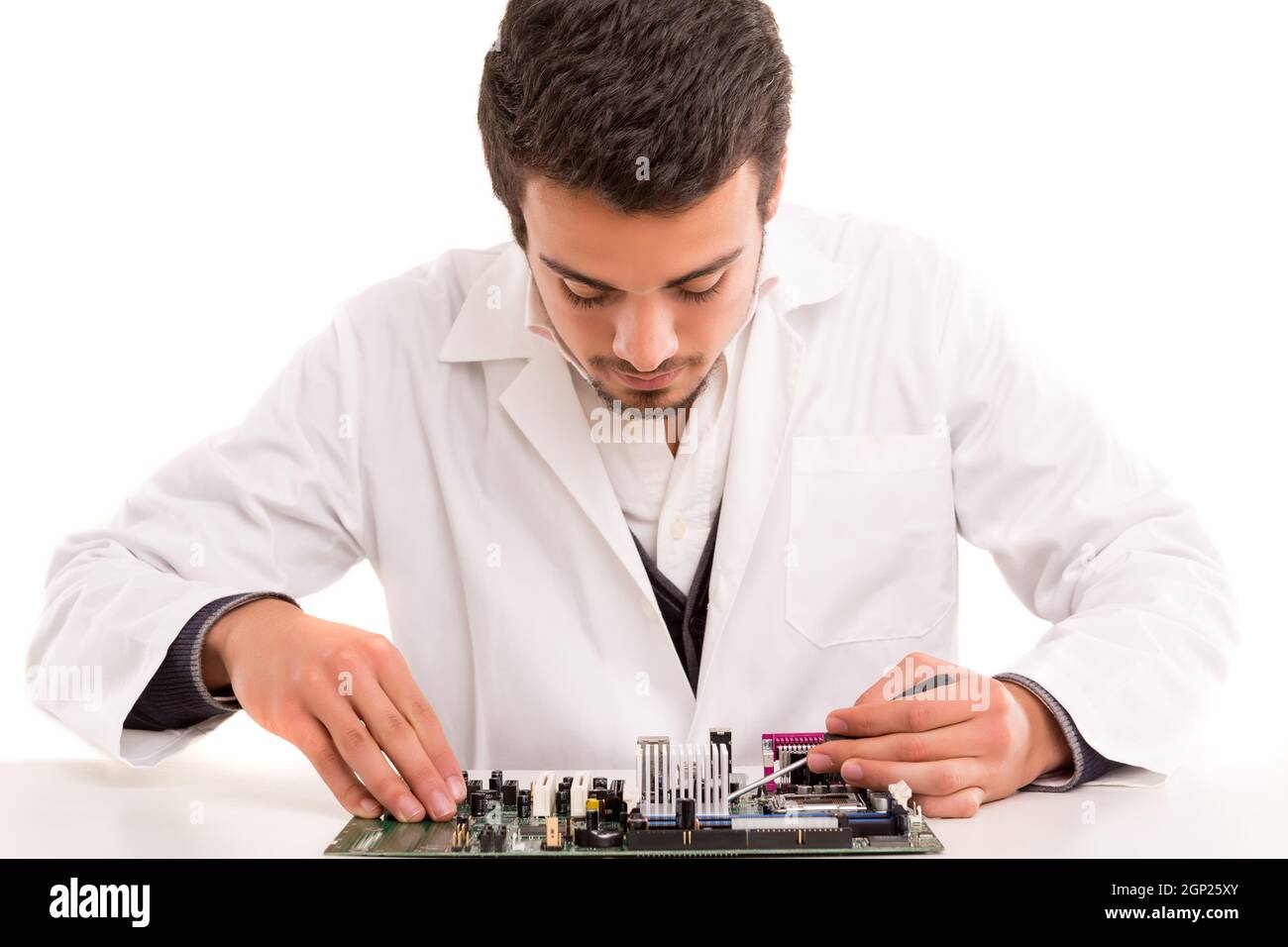 A computer engineer or technician, working on a computer motherboard ...