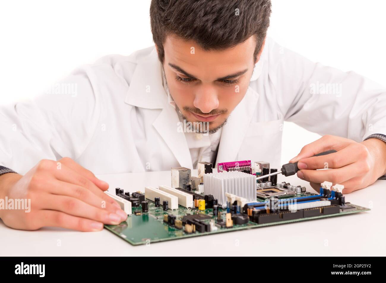 A computer engineer or technician, working on a computer motherboard ...