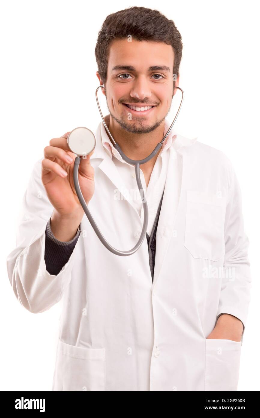 Handsome young medic holding a stethoscope, isolated over white Stock ...