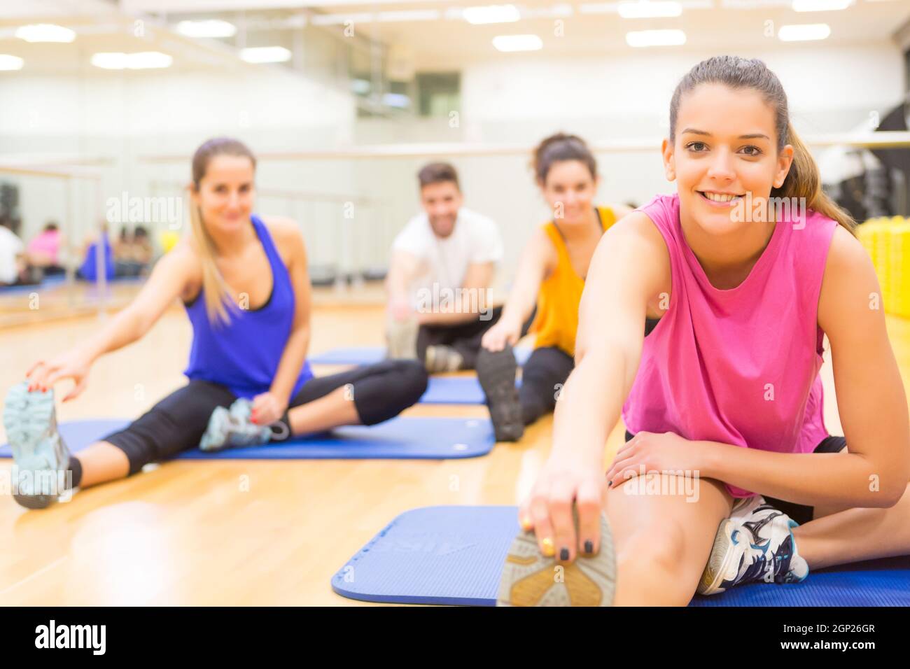 Group of friends working out at the gym Stock Photo - Alamy