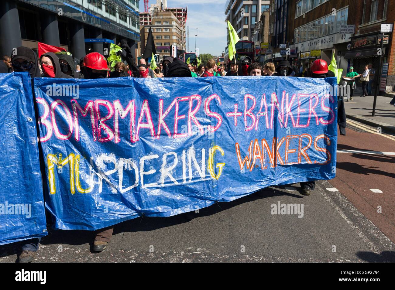 Anti arms trade protesters marching down Aldgate High Street, to ...