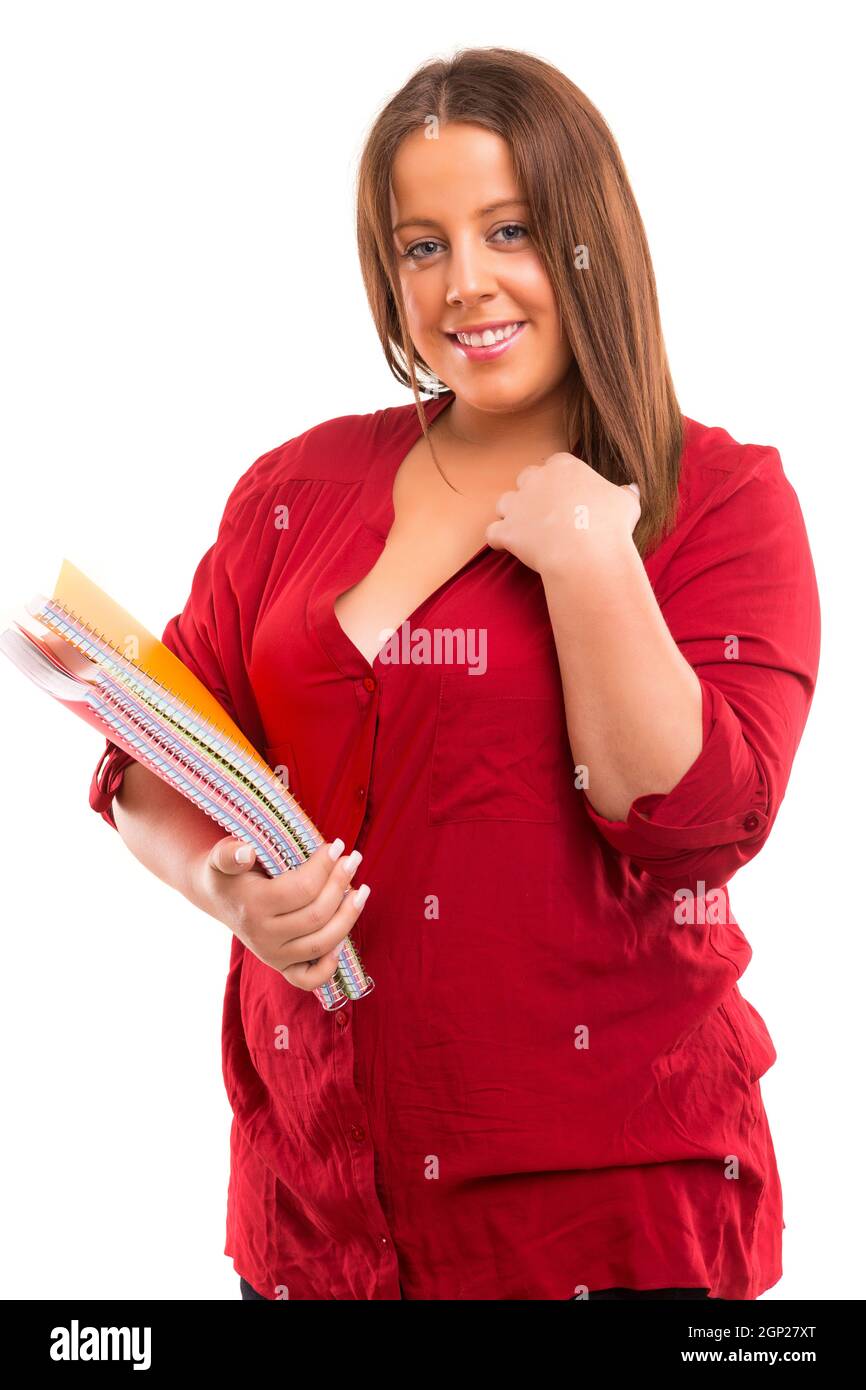 A beautiful large student woman, posing isolated over white background ...
