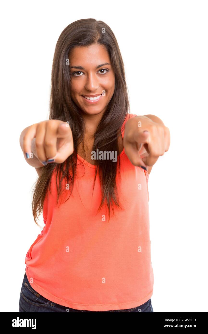 A beautiful woman pointing to something, isolated over a copy space ...