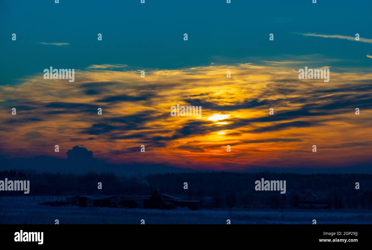 The beautiful sunset with tracks in snow winter background Stock Photo ...