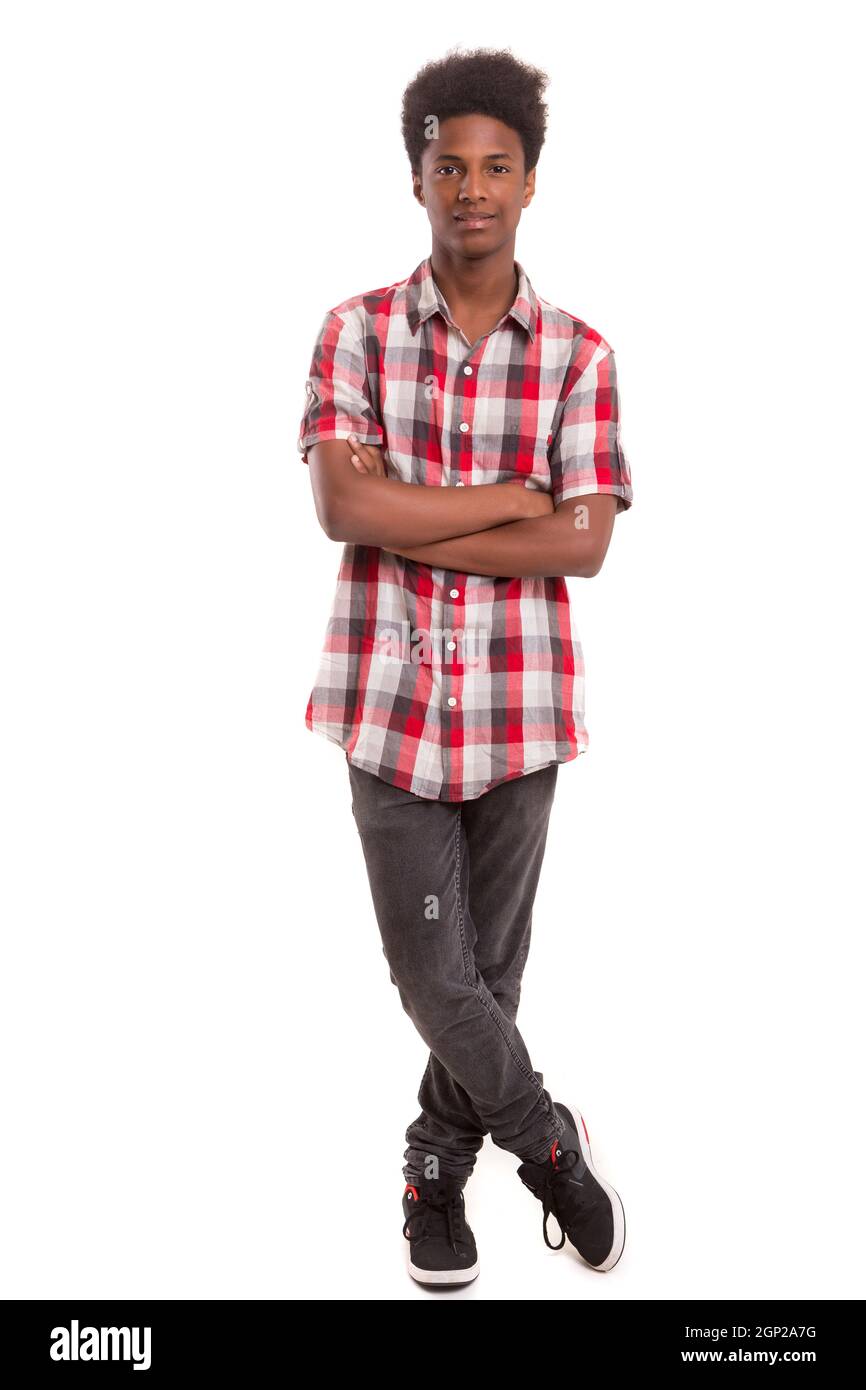 A casual young black boy posing isolated Stock Photo - Alamy