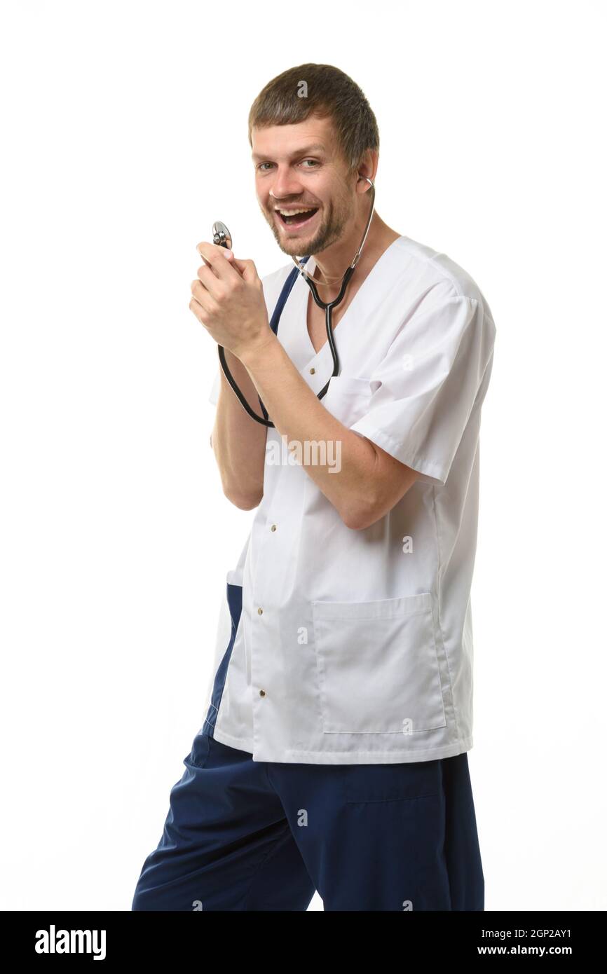 Cheerful doctor singing into impromptu microphone from phonendoscope ...