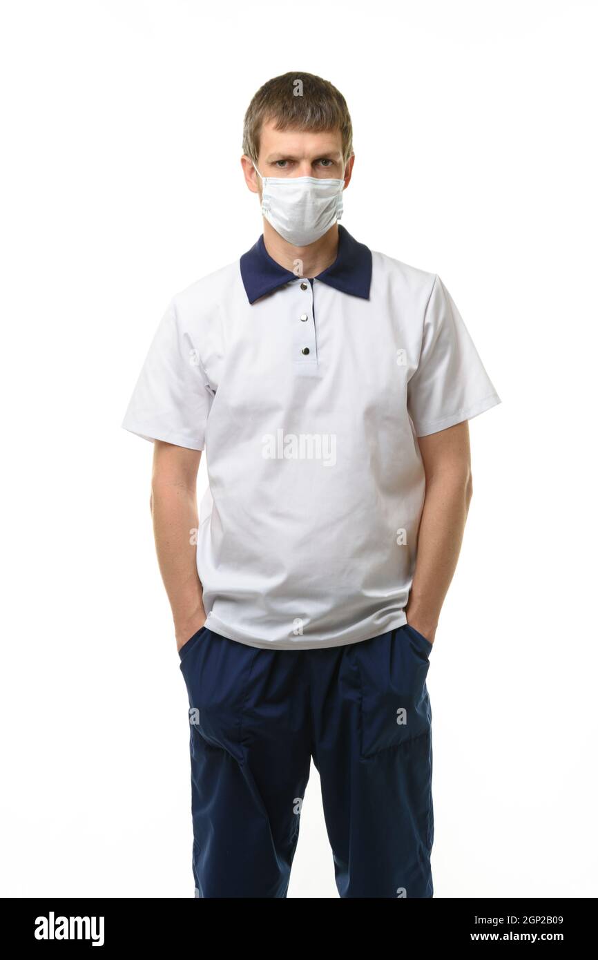 Masked doctor thrust his hands into pockets isolated on white Stock ...