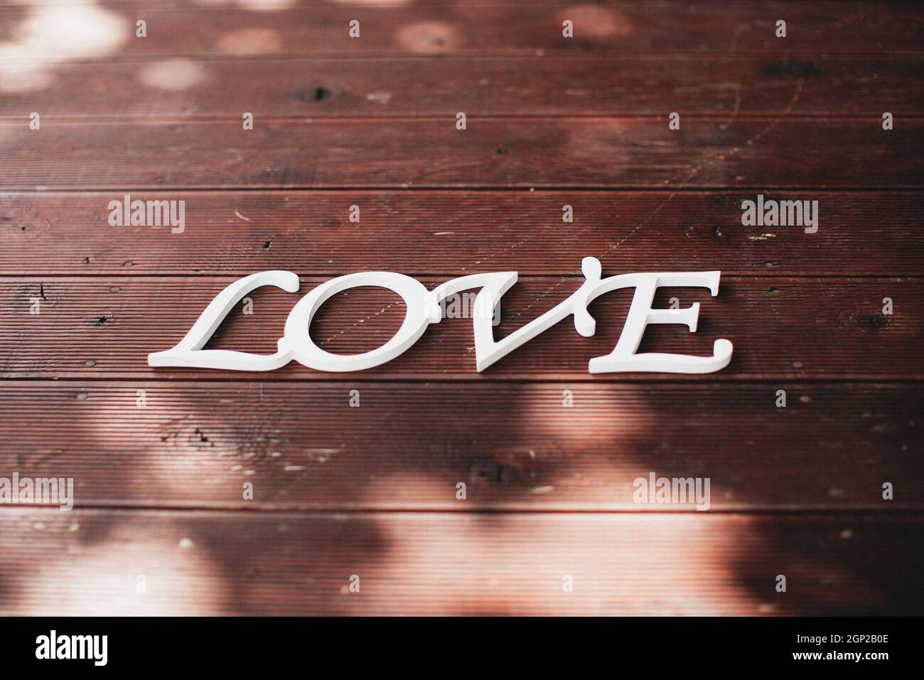 White word love on the brown wood. High quality photo Stock Photo - Alamy