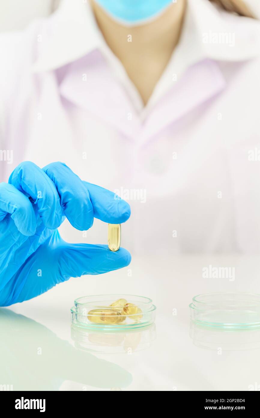 Close up Scientist hands putting in nitrile blue latex gloves holding ...