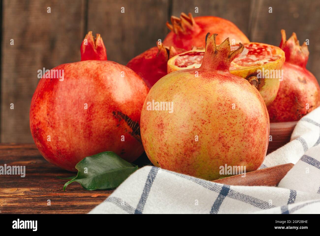 Group of pomegranate fruits close up background Stock Photo - Alamy