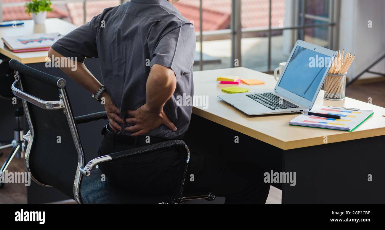 Asian hard senior businessman working with laptop computer has a ...