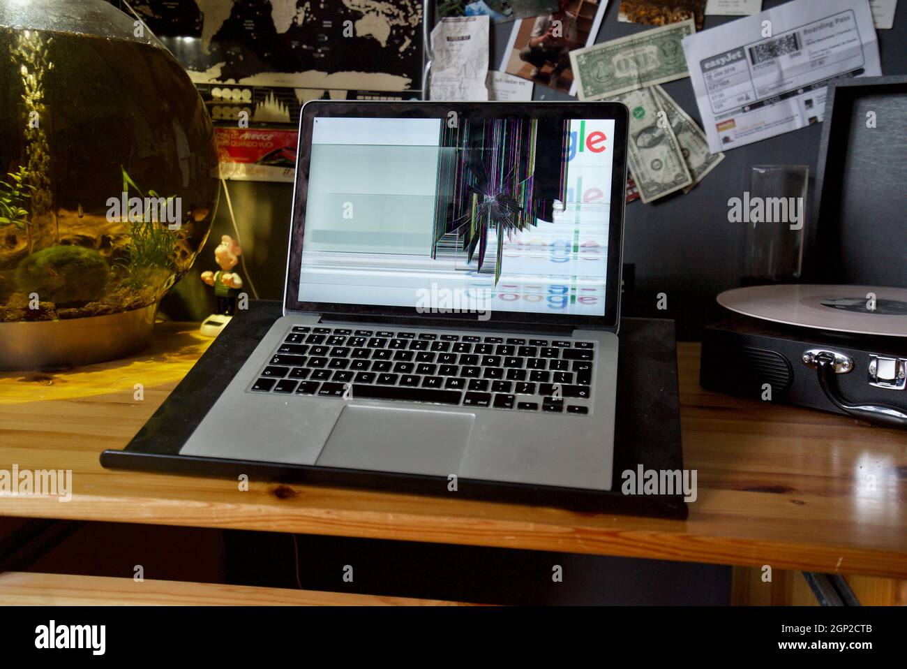Laptop with a smashed screen (MacBook Pro, Retina 13-inch 2015) with a ...