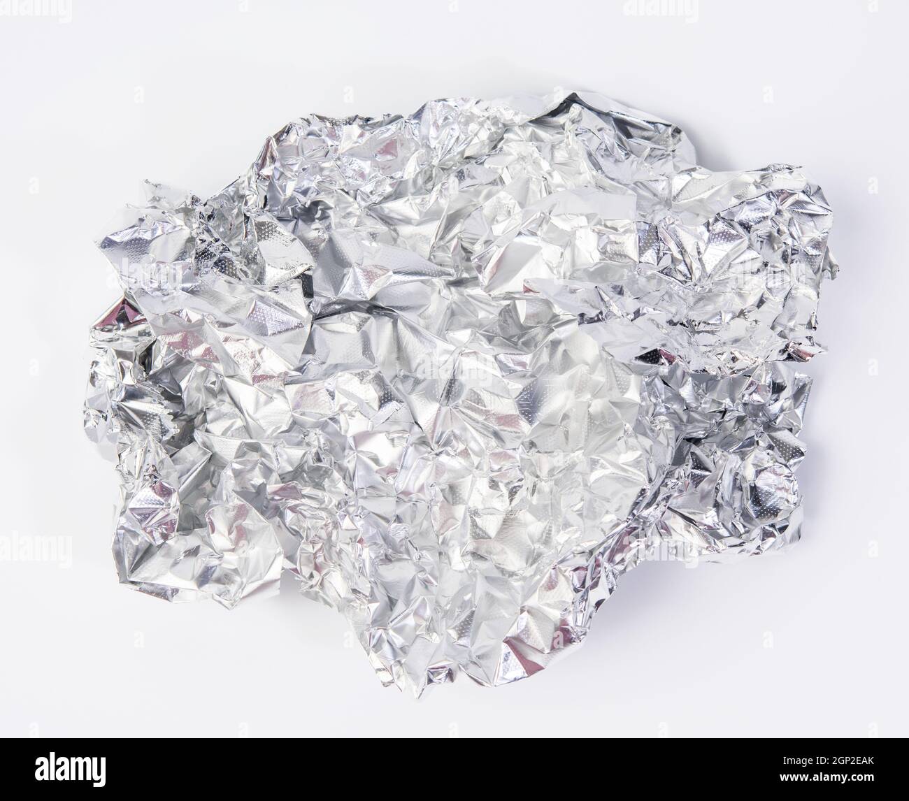 crumpled piece of gray foil on a white background, top view Stock Photo ...