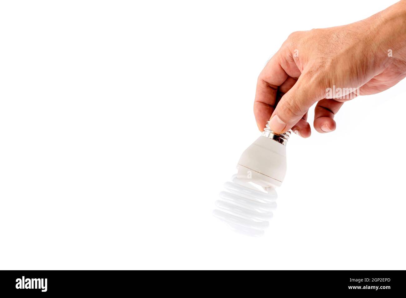 Human hand holding fluorescent light bulb isolated on white background ...