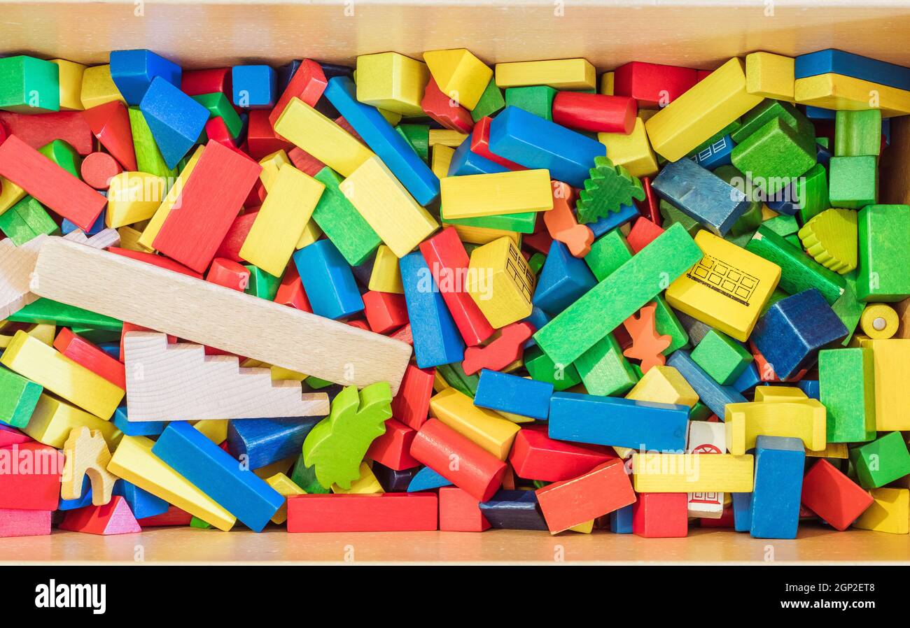 Colorful wooden toy blocks in a box Stock Photo - Alamy