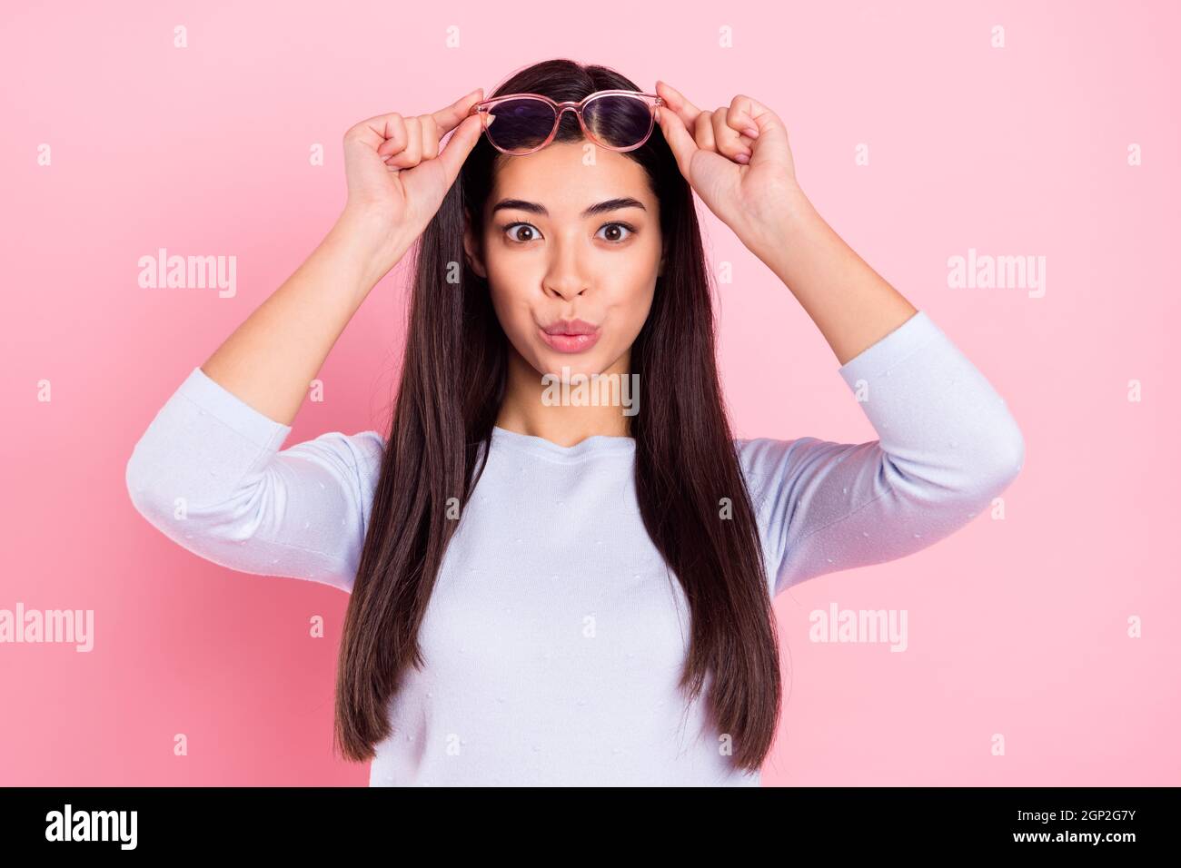 Portrait of attractive amazed girl touching specs news reaction pout ...