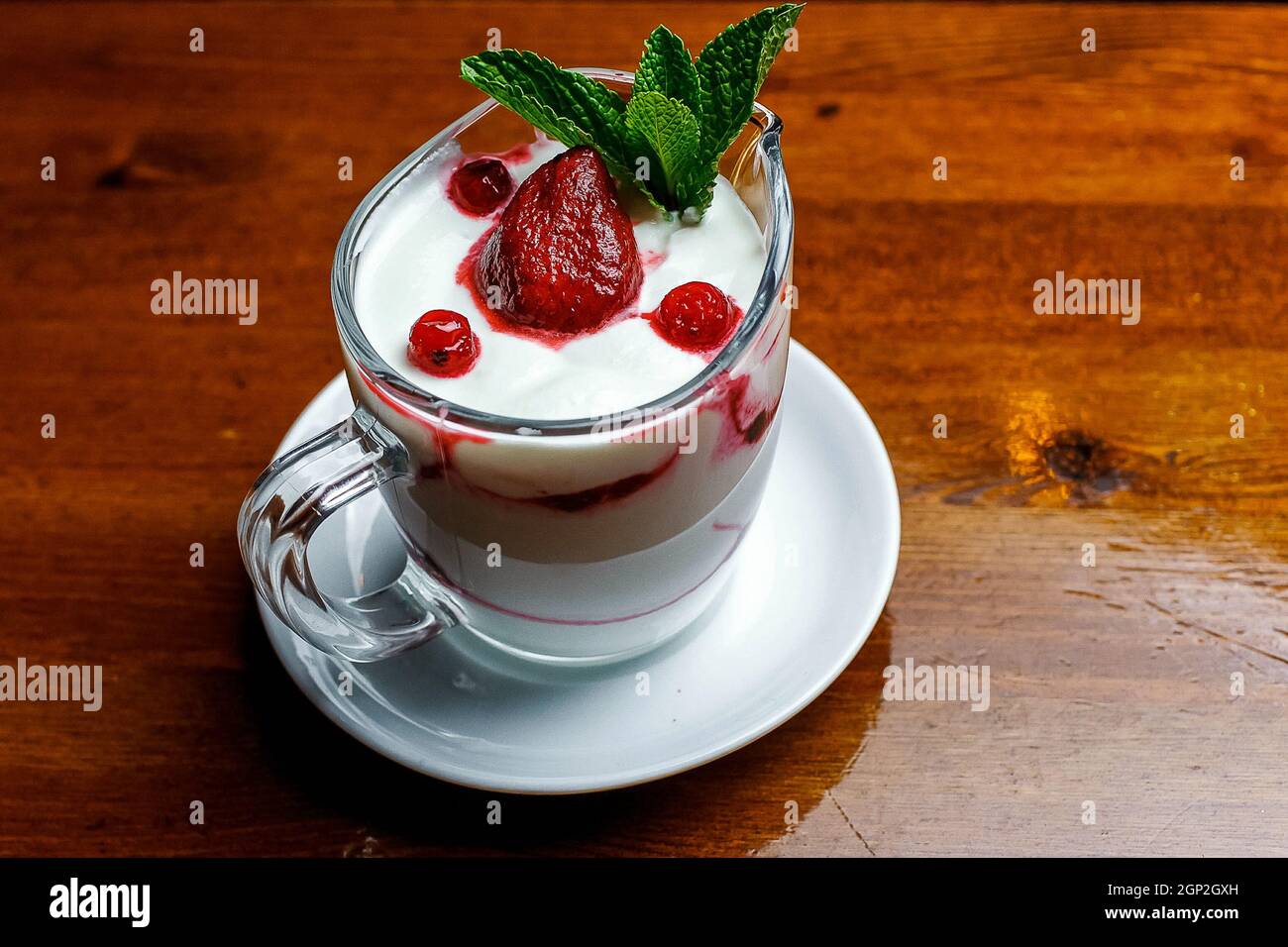 Strawberries in kefir in a cup. Currants and strawberries Stock Photo ...