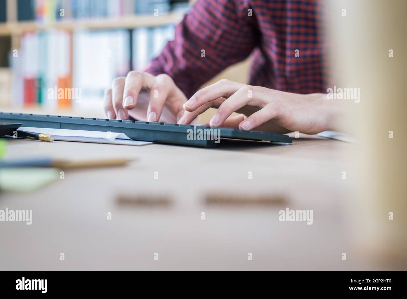 Typing hands on keyboard, home office with text space Stock Photo - Alamy