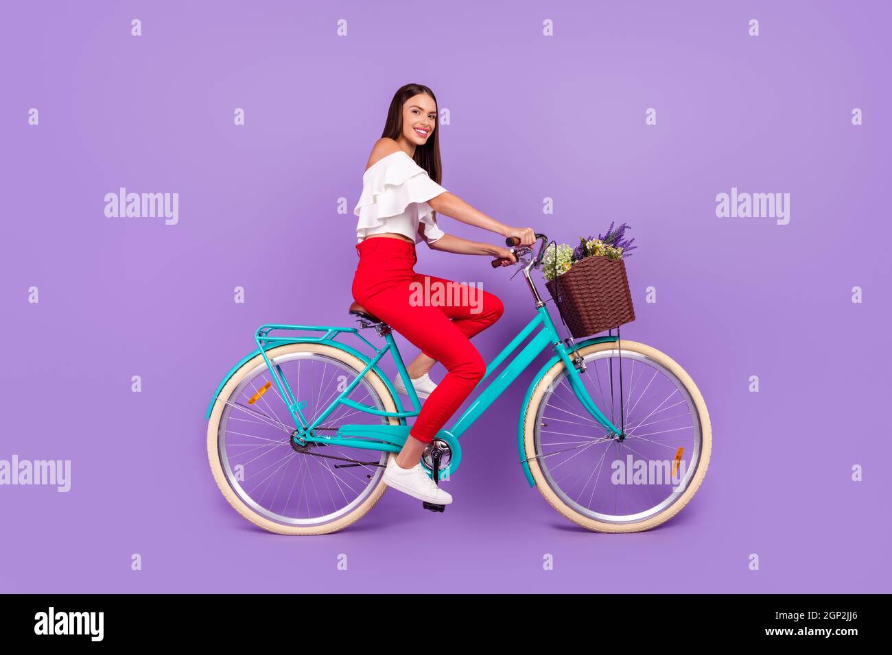 Photo of cheerful lady ride bicycle spring weekend wear white blouse ...