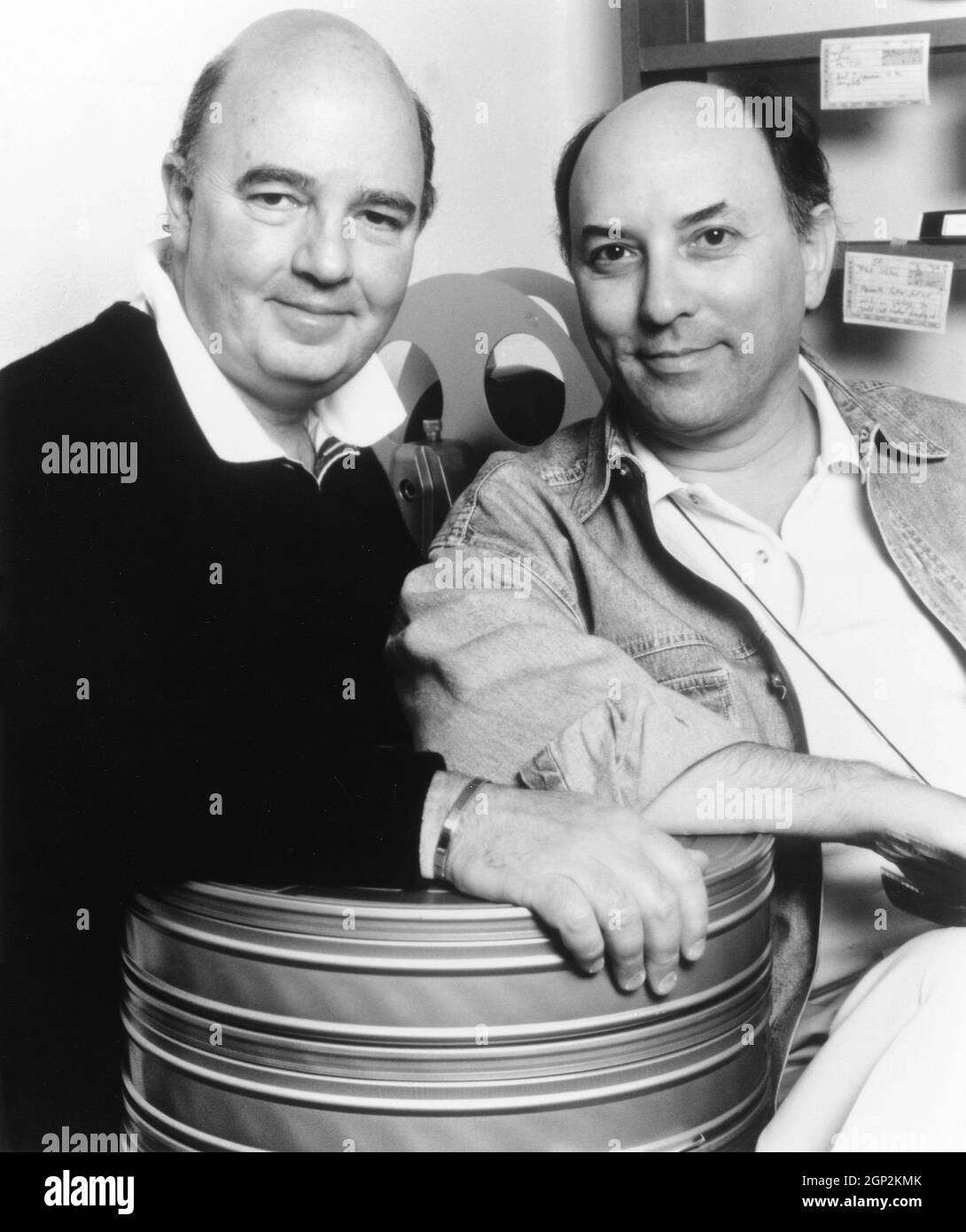 VERTIGO, from left: restorers James C. Katz, Robert A. Harris, with 70mm film cans, circa 1996 ...