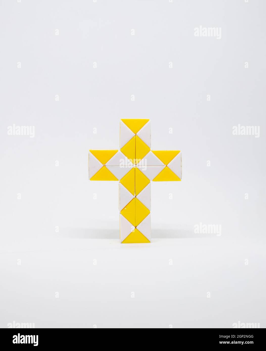 cross made of yellow and white triangles on a white background Stock ...