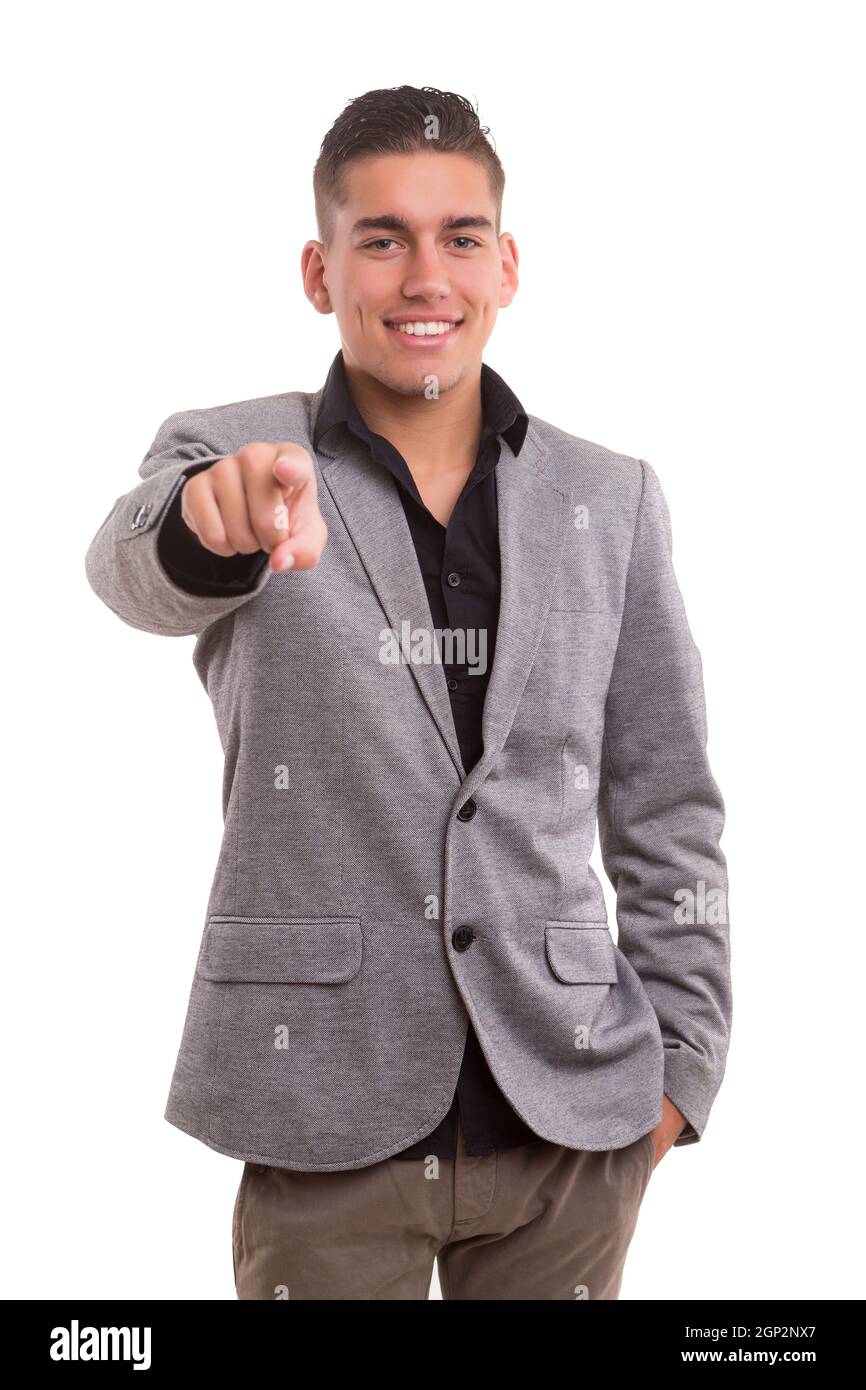 Handsome young man pointing at you, isolated over white background ...