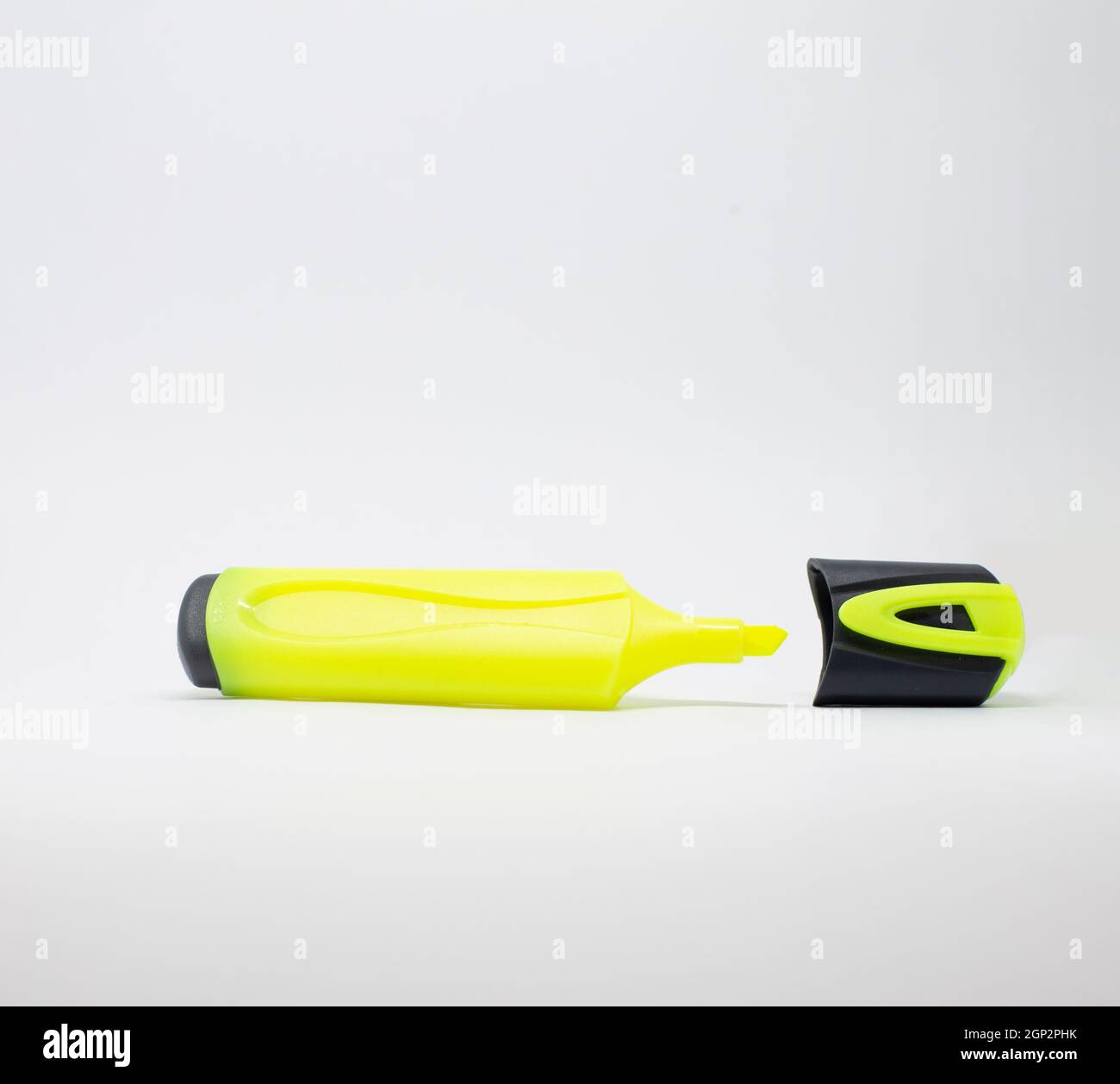 Yellow marker with cap off on a white background Stock Photo - Alamy