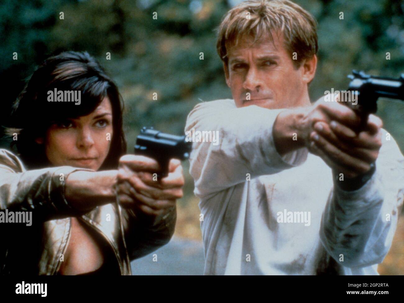 BOUNTY HUNTERS, from left: Lisa Howard, Michael Dudikoff, 1996 ...