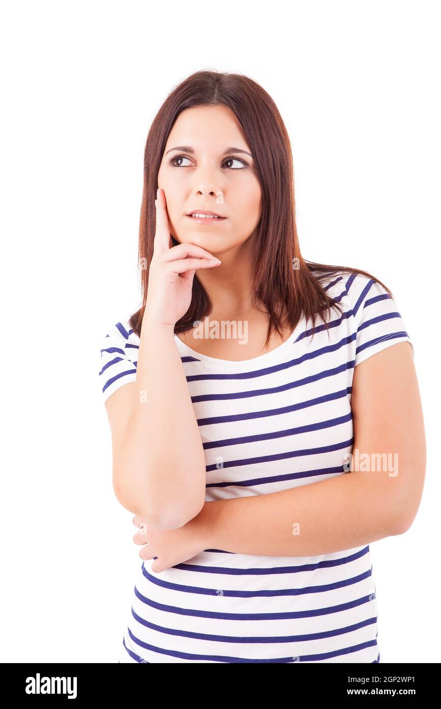 A portrait of a young woman trying to make a decision, isolated over ...