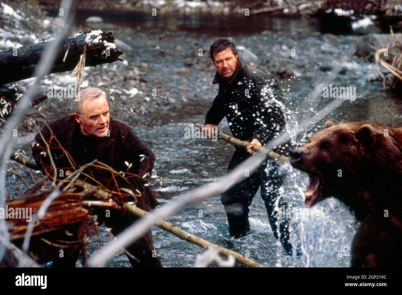 THE EDGE, from left: Anthony Hopkins, Alec Baldwin, 1997. ph: Joe ...