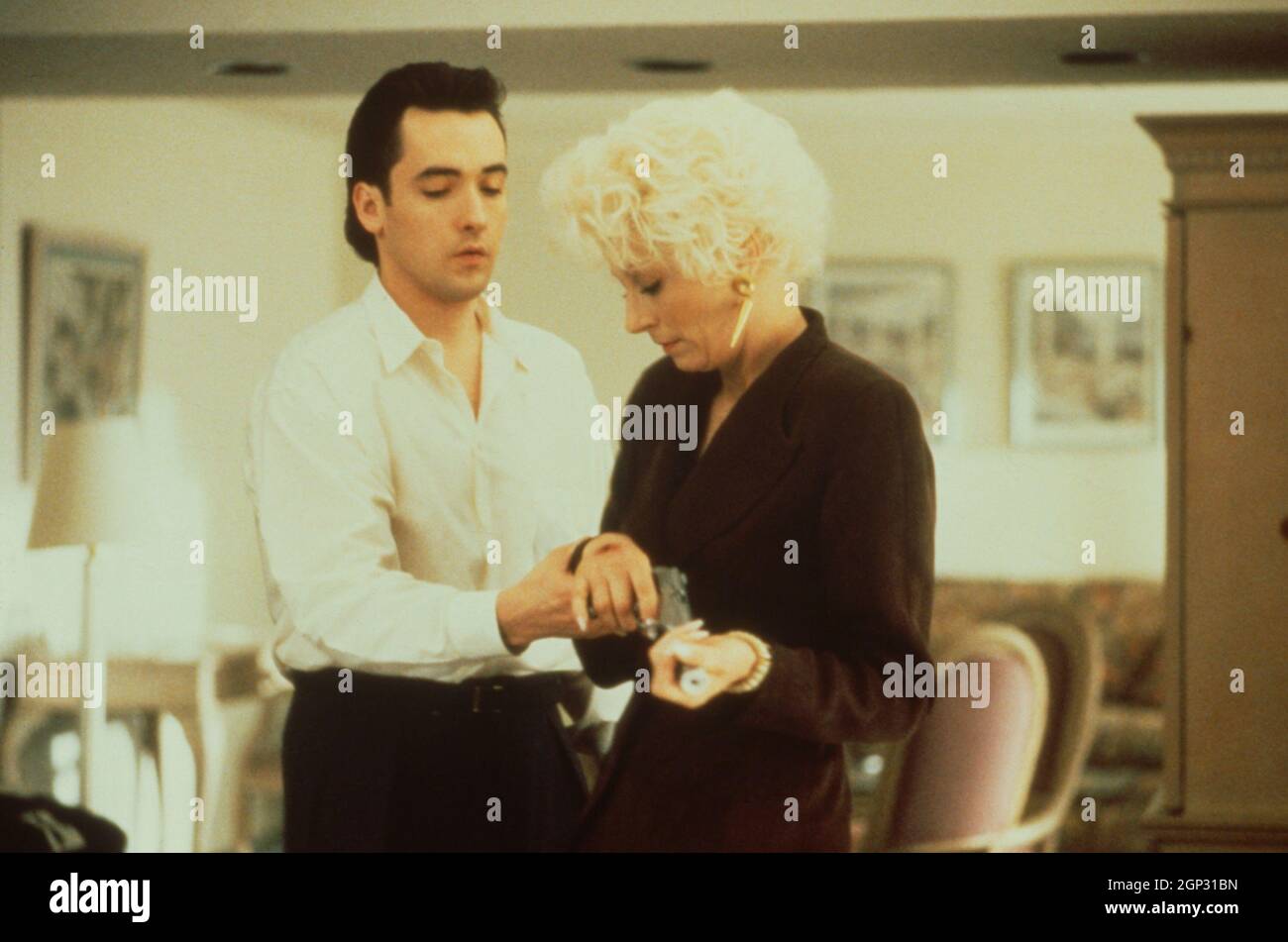 THE GRIFTERS, from left: John Cusack, Anjelica Huston, 1990. ph ...