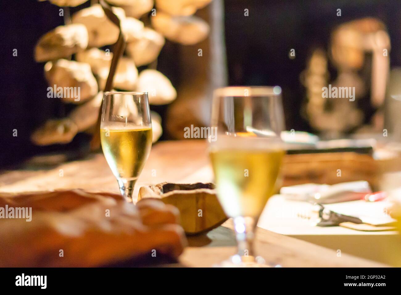Glass of white wine on rustic bar counter Stock Photo - Alamy