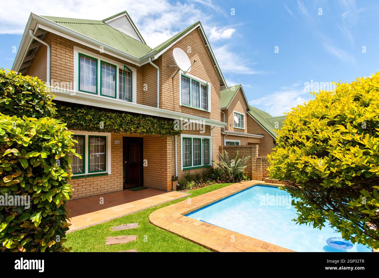 Two story family home with private swimming pool Stock Photo - Alamy