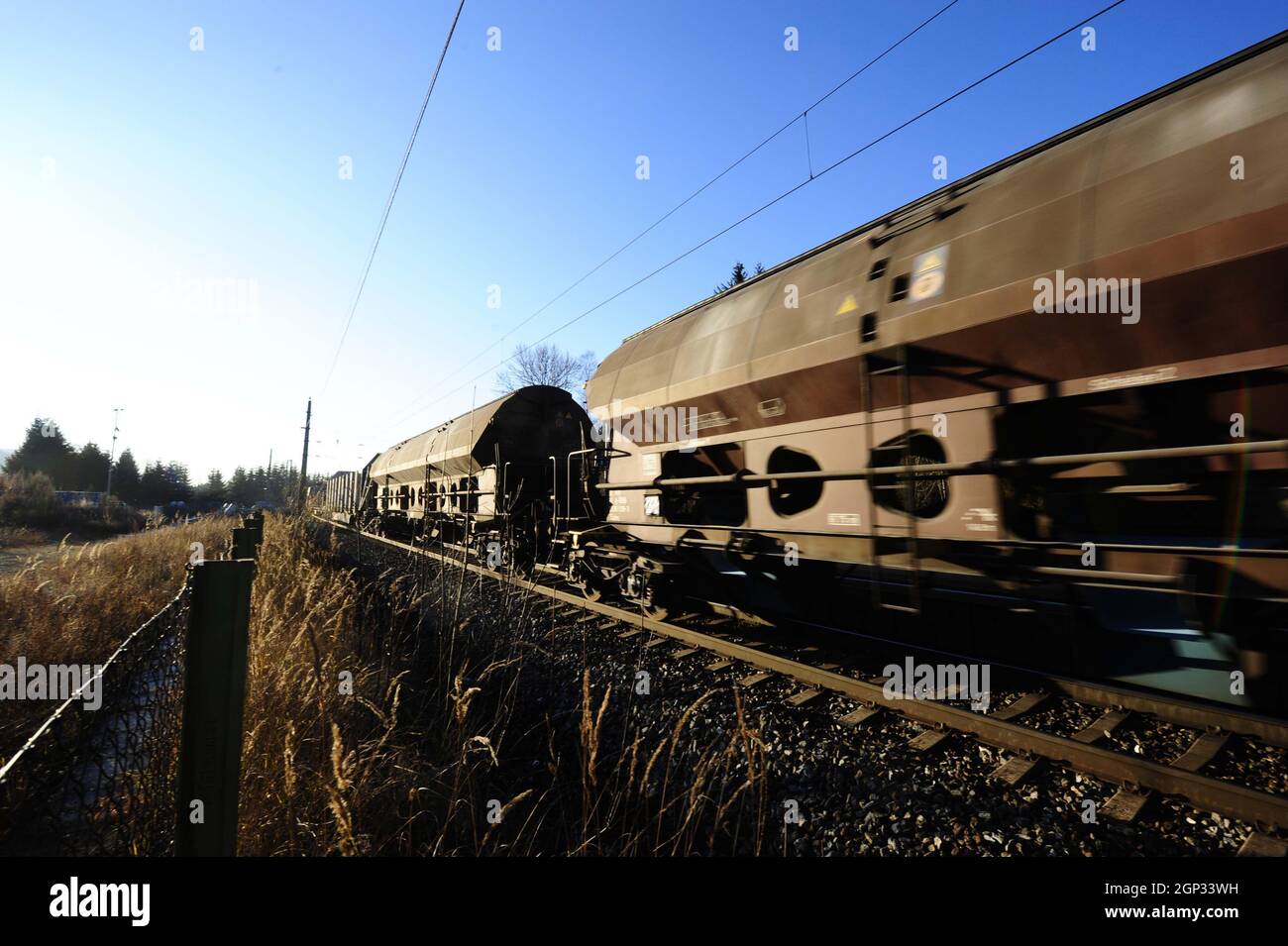 a freight train for the transportation of goods by rail Stock Photo - Alamy