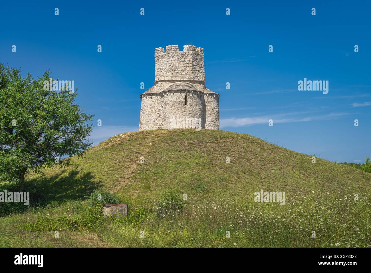 Small tower like 11th century St. Nicholas church located on small hill ...