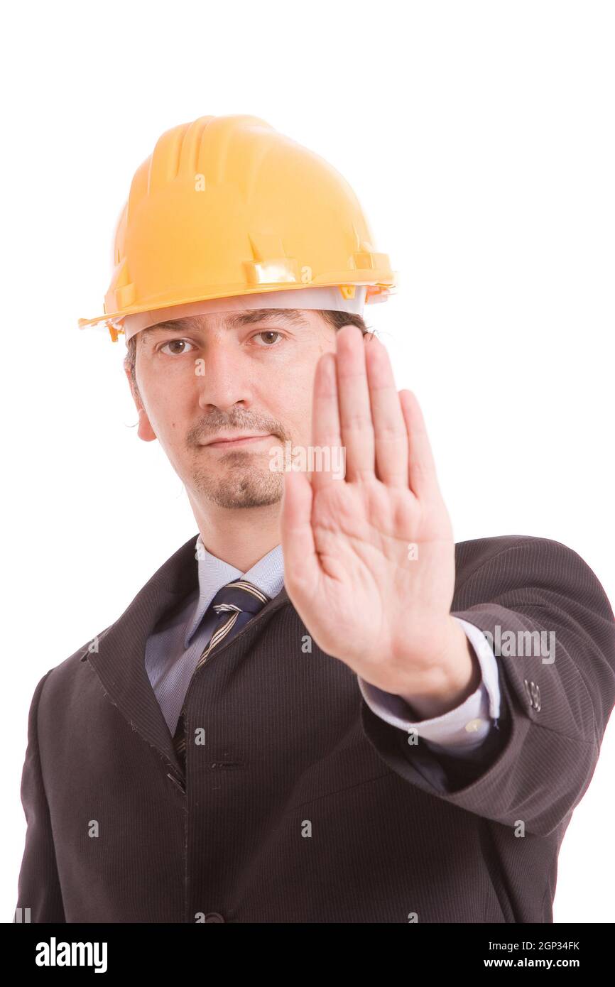 Engineer with yellow hat making stop sign Stock Photo - Alamy