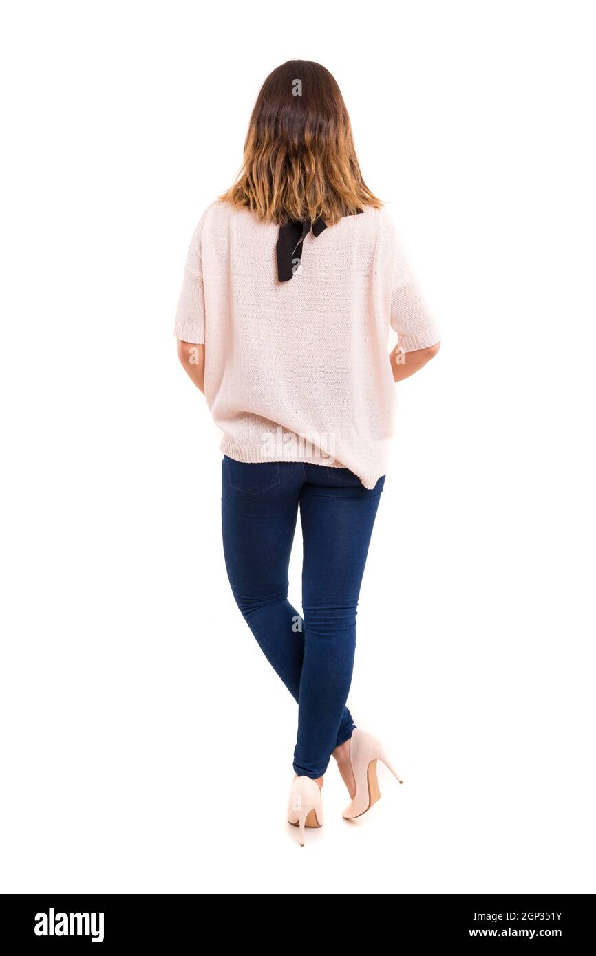 Woman posing with her back faced to camera, isolated over copy space ...
