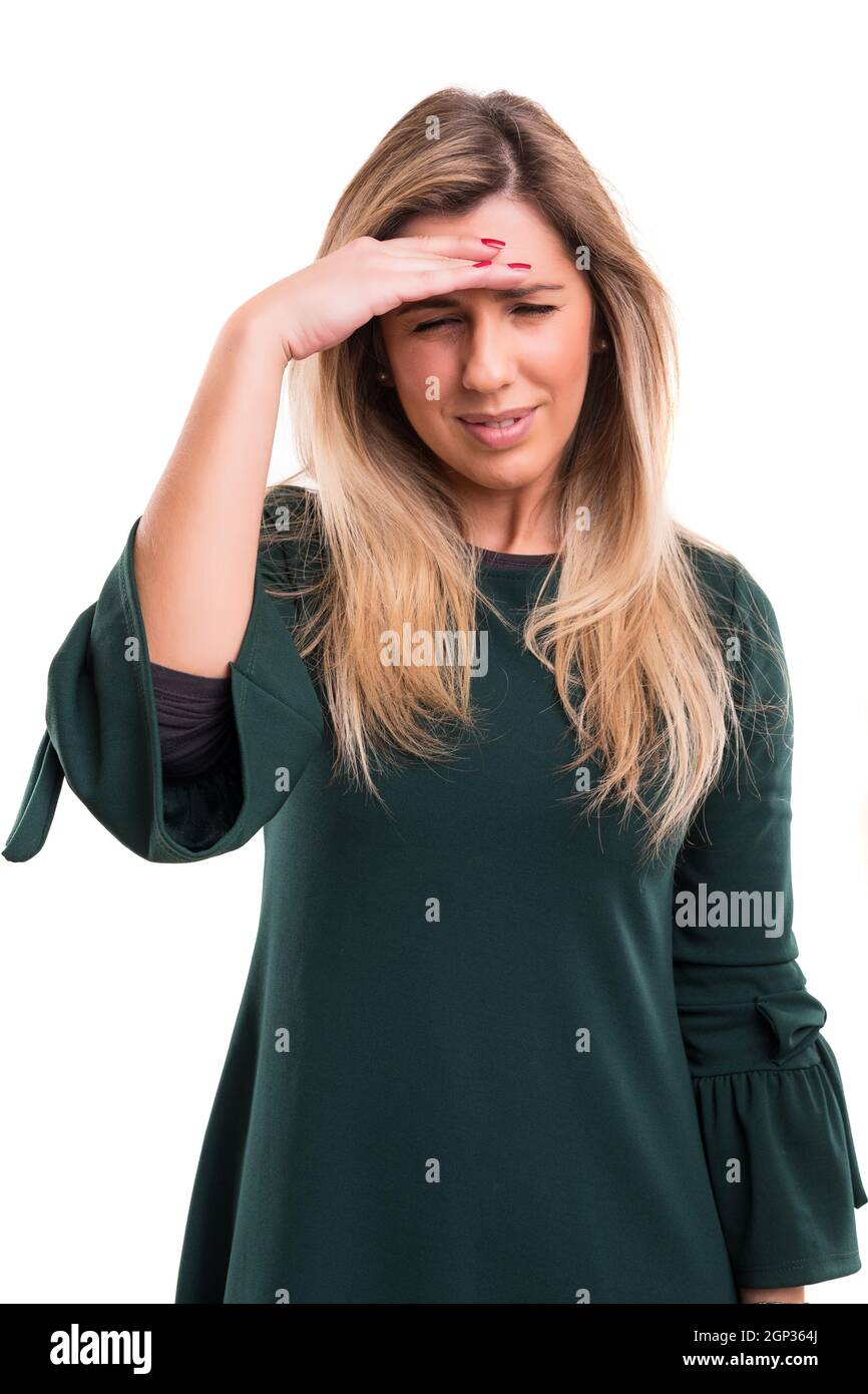 Young woman with a strong headache, isolated over white background ...