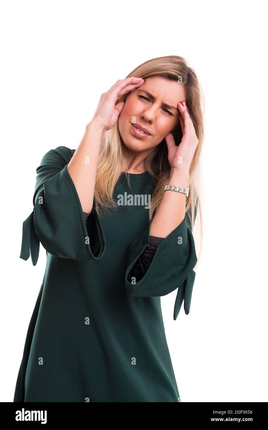Young woman with a strong headache, isolated over white background ...