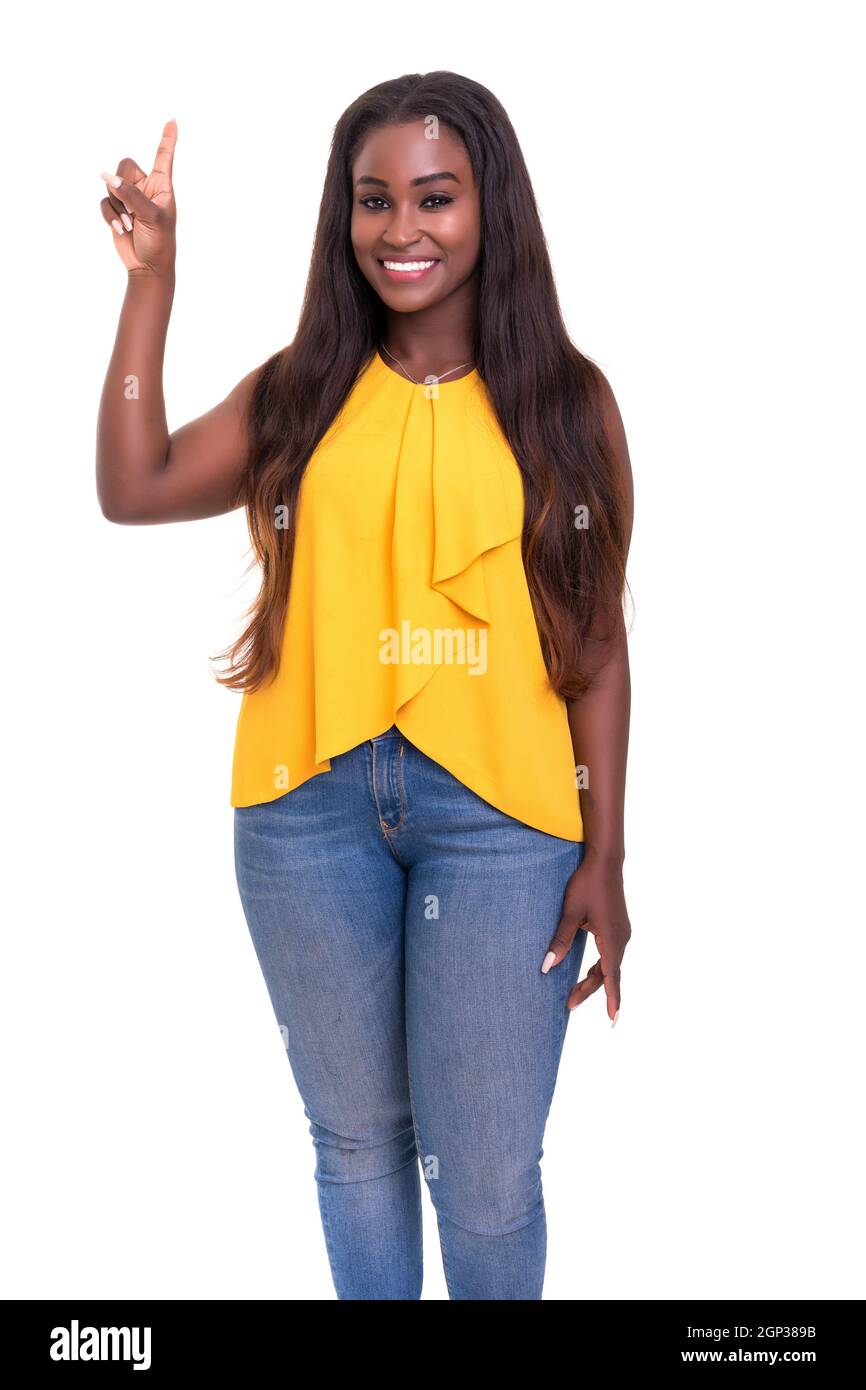 A beautiful african woman pointing to something, isolated over a white ...