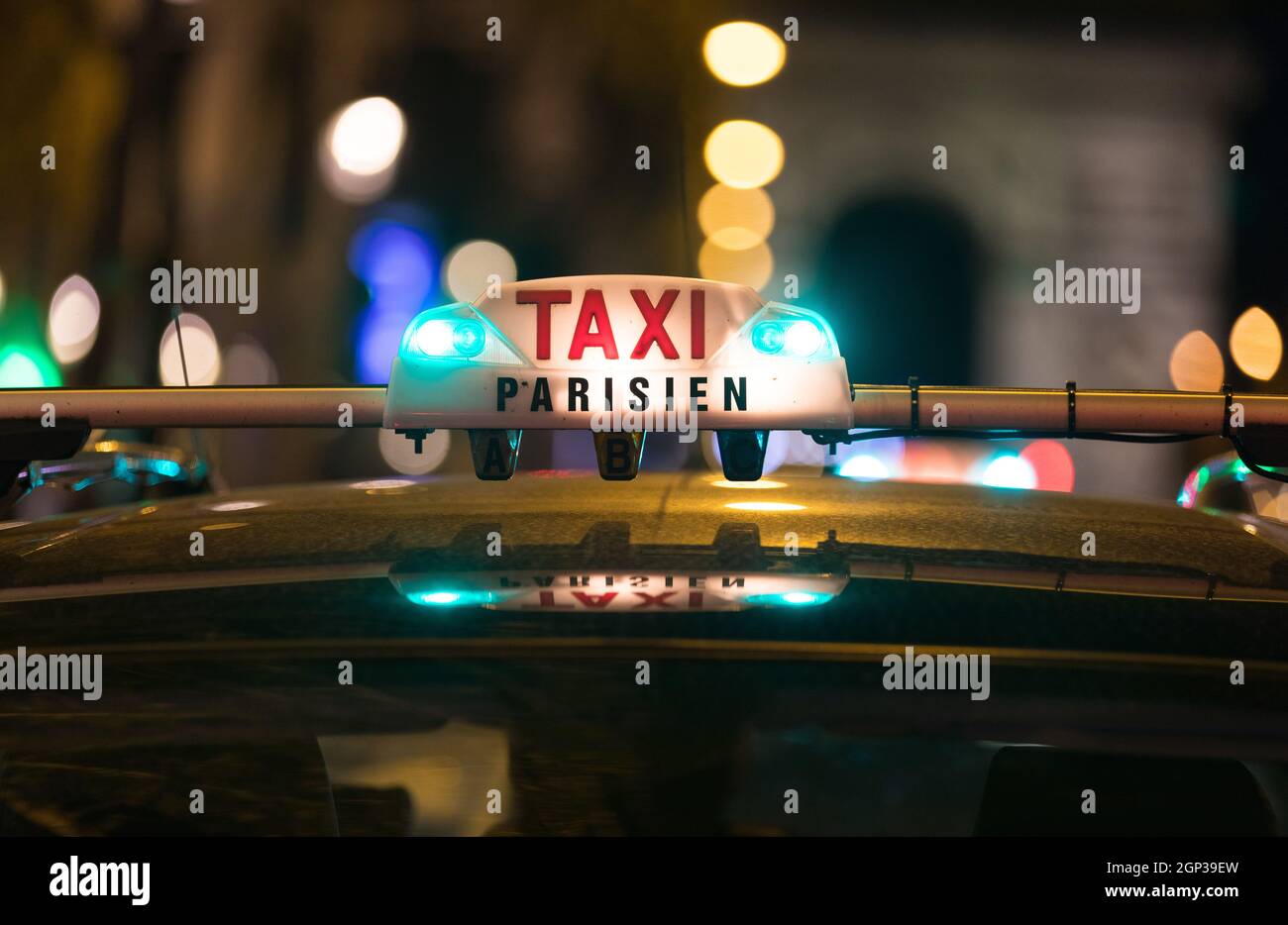 French taxi with the champs elysees avenue in background Stock Photo ...
