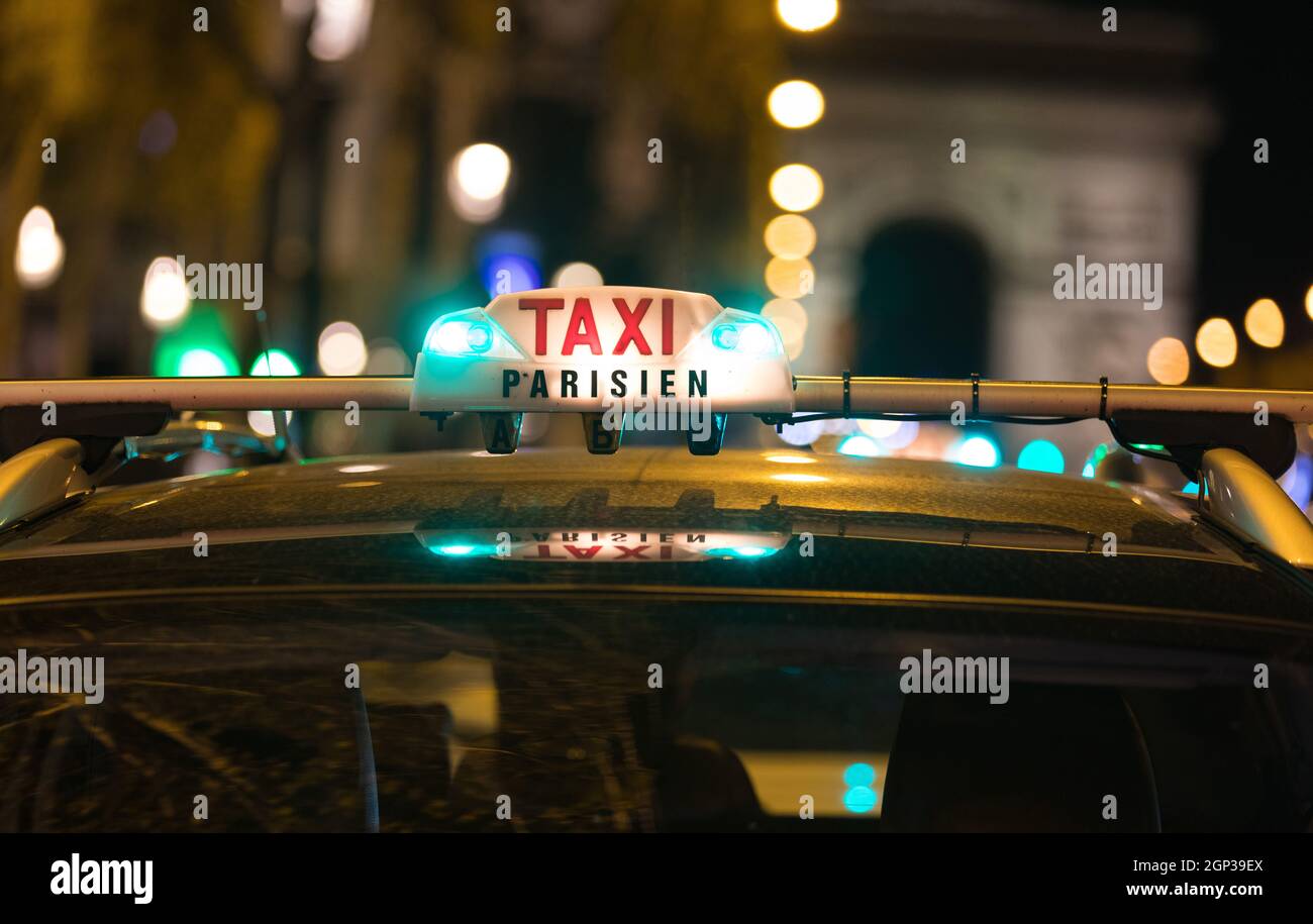 French taxi with the champs elysees avenue in background Stock Photo ...