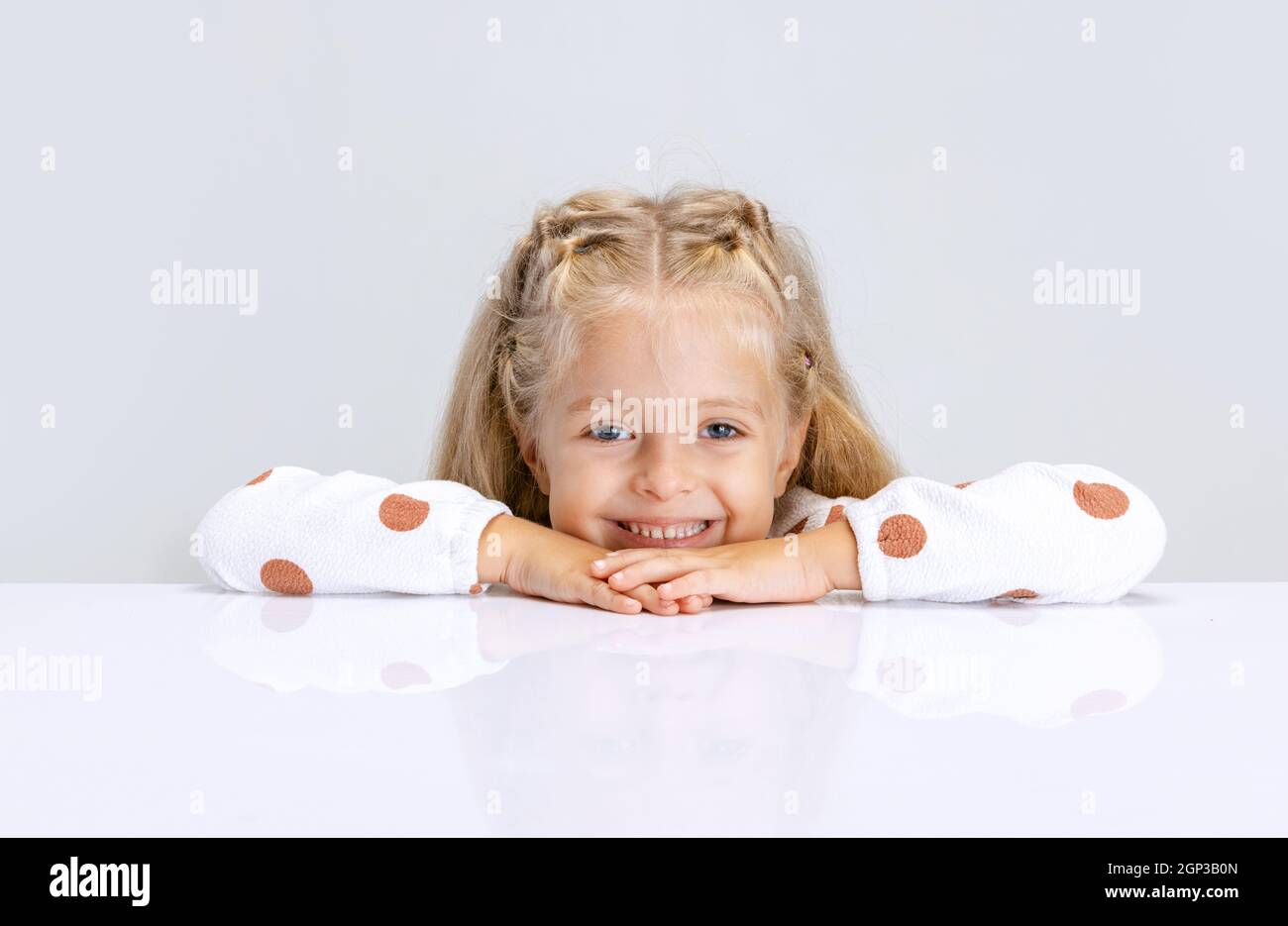 Portrait of little preschool girl, child playing game isolated over ...