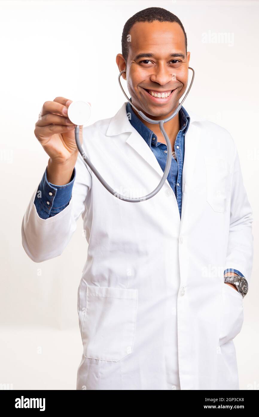 Handsome young african doctor posing isolated over a white background ...