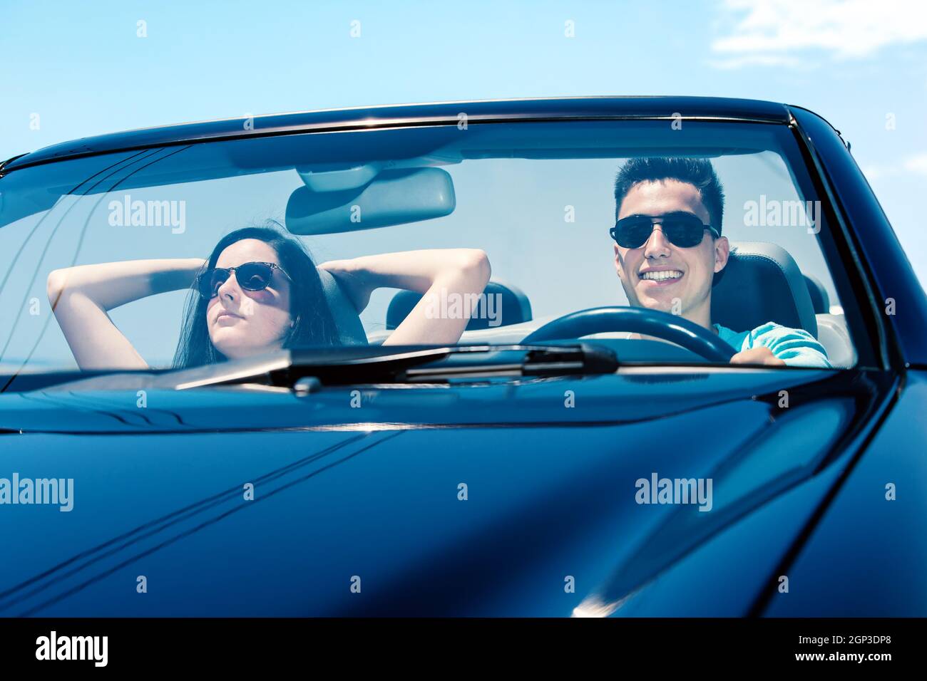 Portrait of attractive young teen Couple driving convertible Stock ...