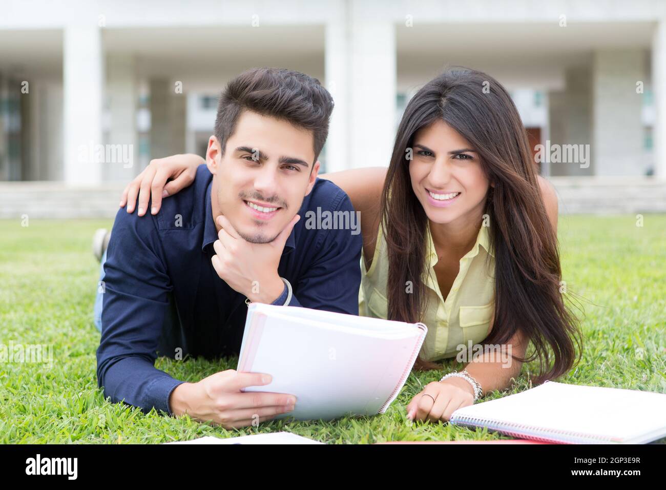 Couple of happy students at the university campus Stock Photo - Alamy