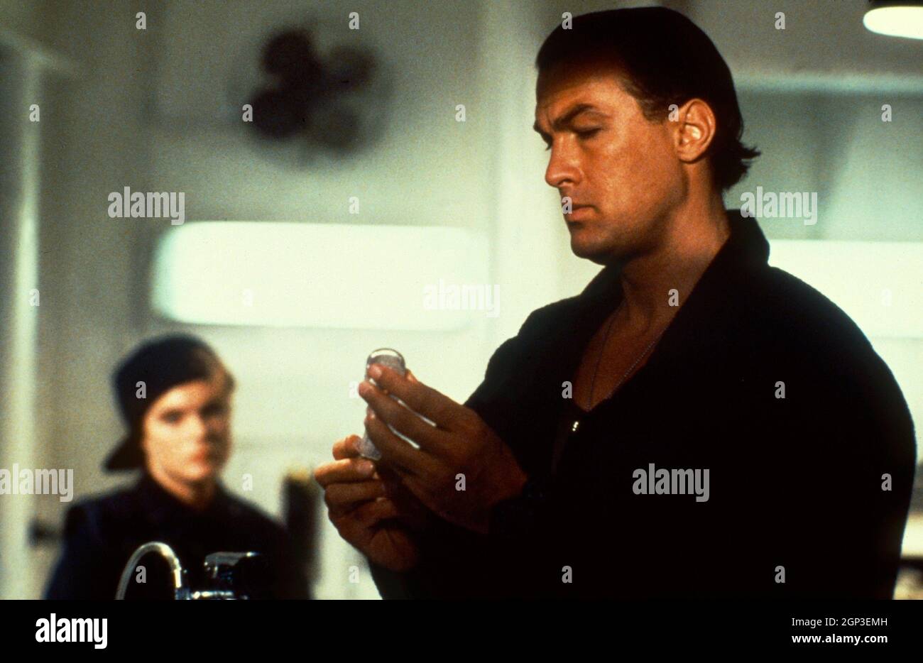 UNDER SIEGE, from left: Erika Eleniak, Steven Seagal, 1992. ph ...