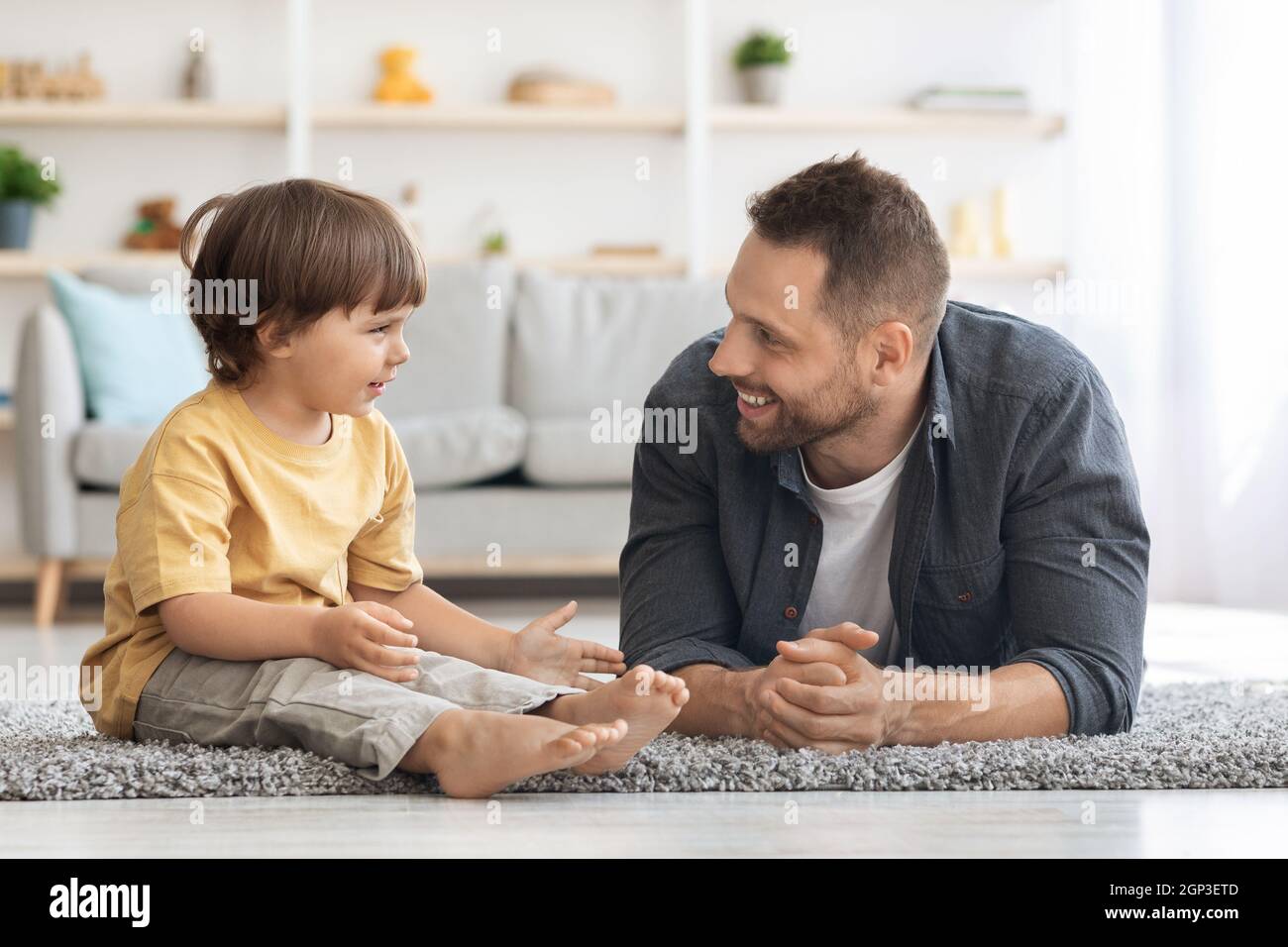 Dad and son communication. Positive little boy talking with his ...
