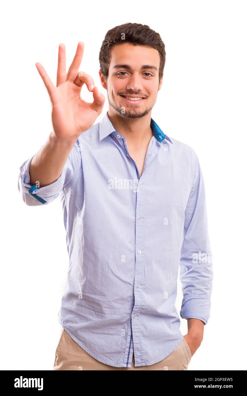 Handsome young man signaling ok, isolated over a white background Stock ...
