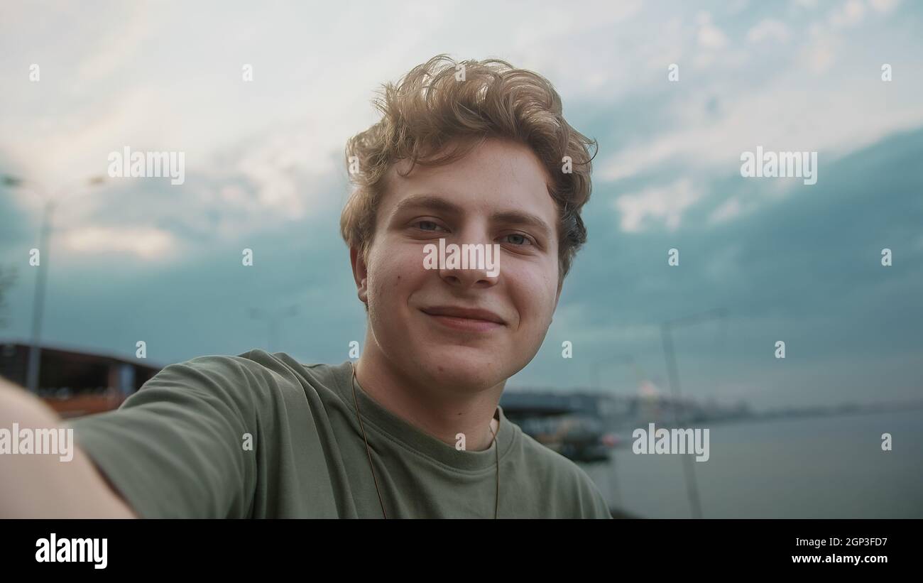 Young blond boy making video call and waving hand he say hello on ...